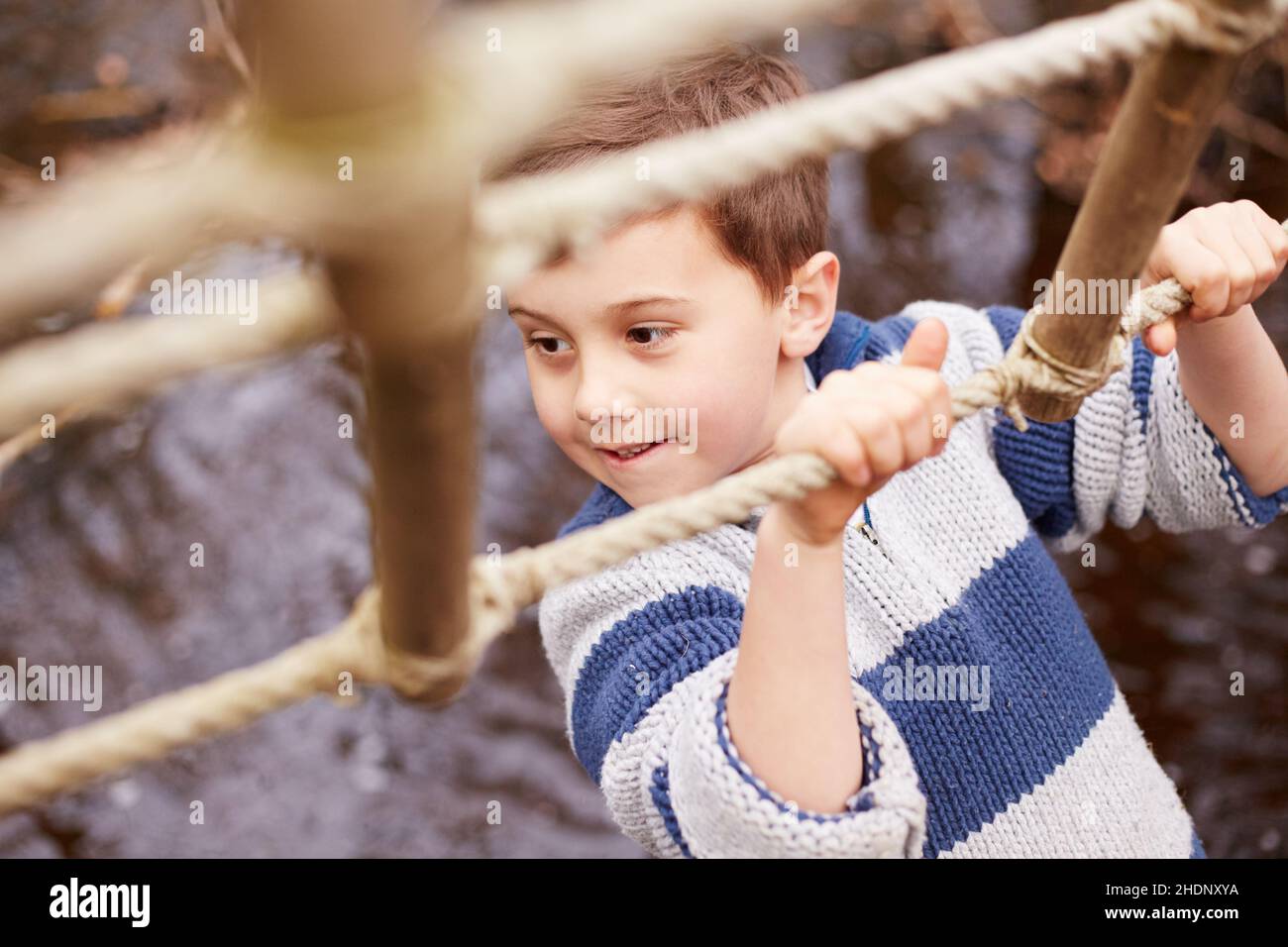boy, balance, rope bridge, boys, balances, rope bridges Stock Photo - Alamy