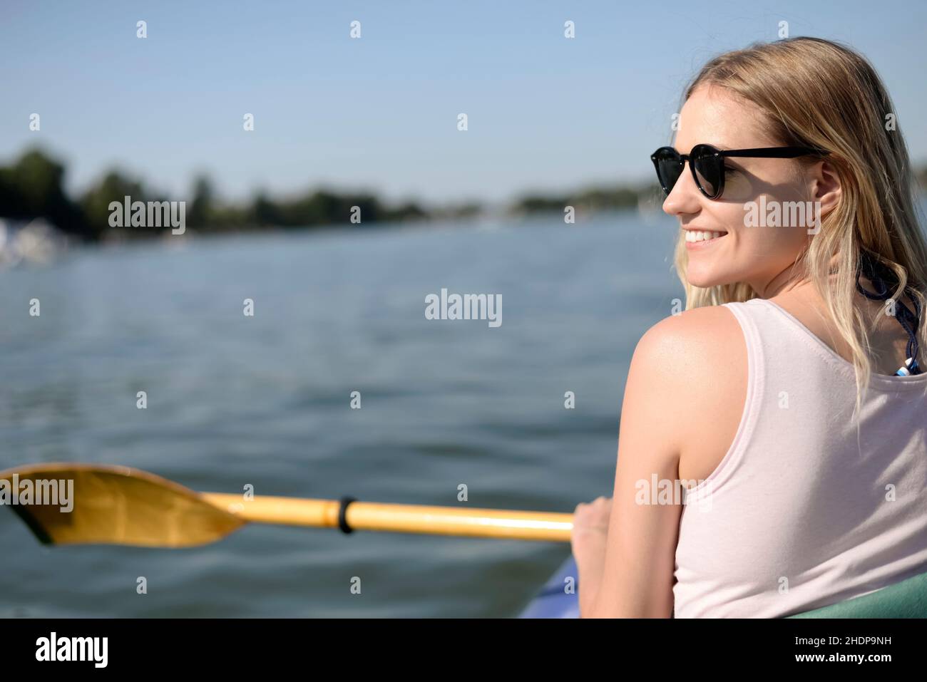 Girls paddling canoes hi-res stock photography and images - Alamy