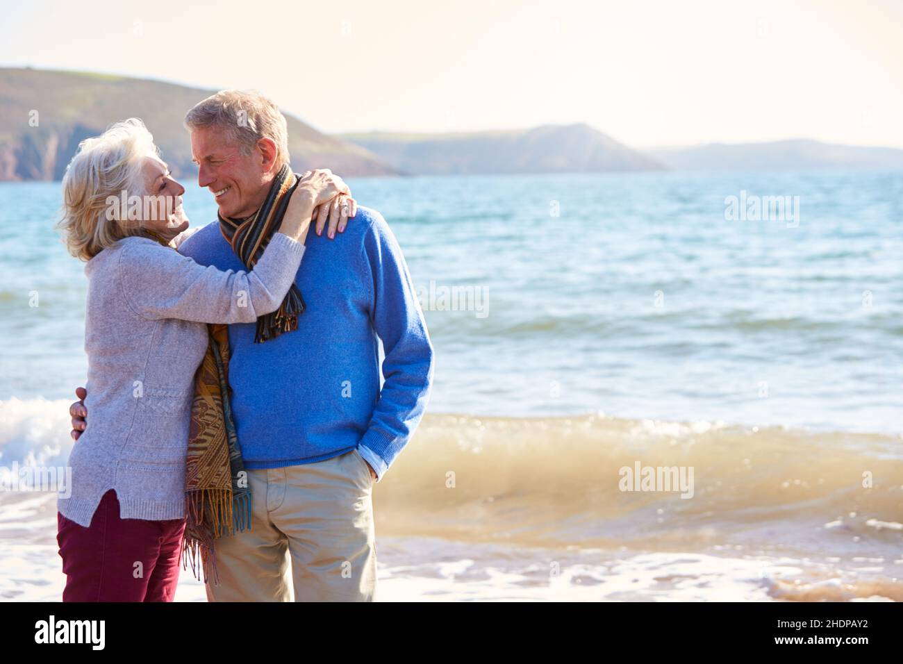embracing, beach walking, older couple, cuddling, hug, hugging, older ...
