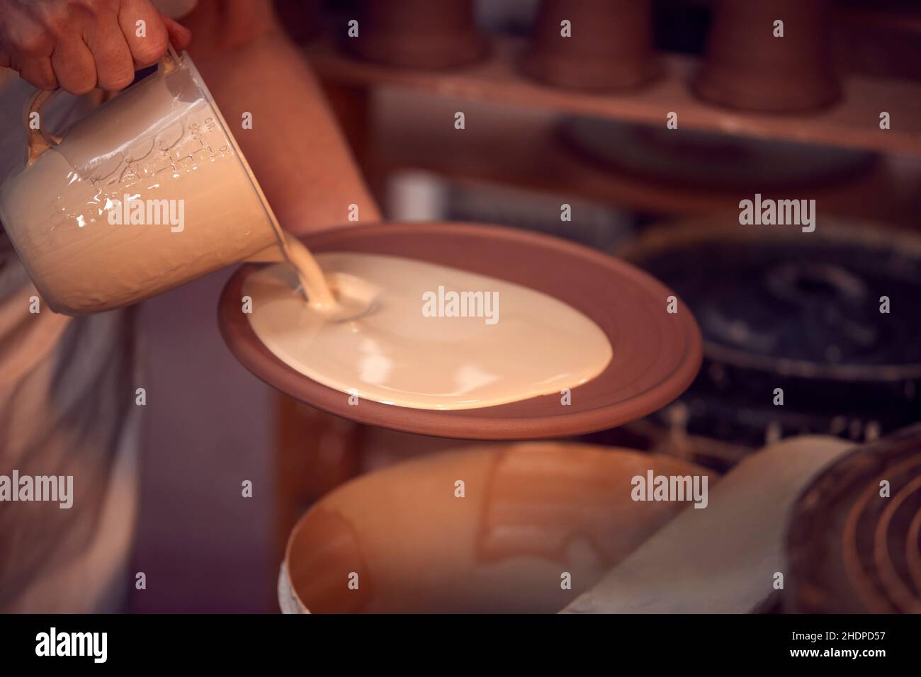 pouring, glaze, pottery, glazes, potteries Stock Photo - Alamy