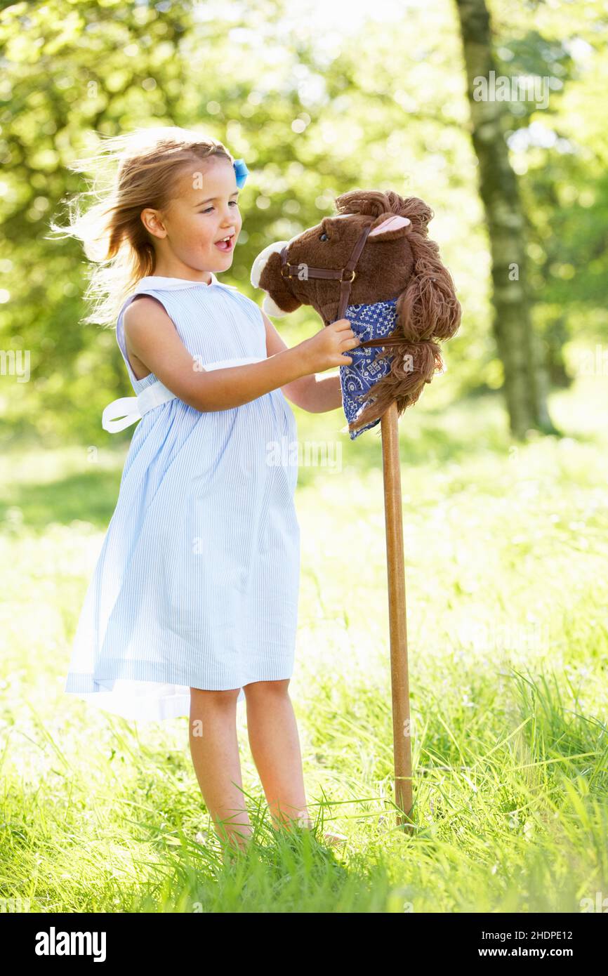 girl, playing, hobby horse, girls, play Stock Photo - Alamy