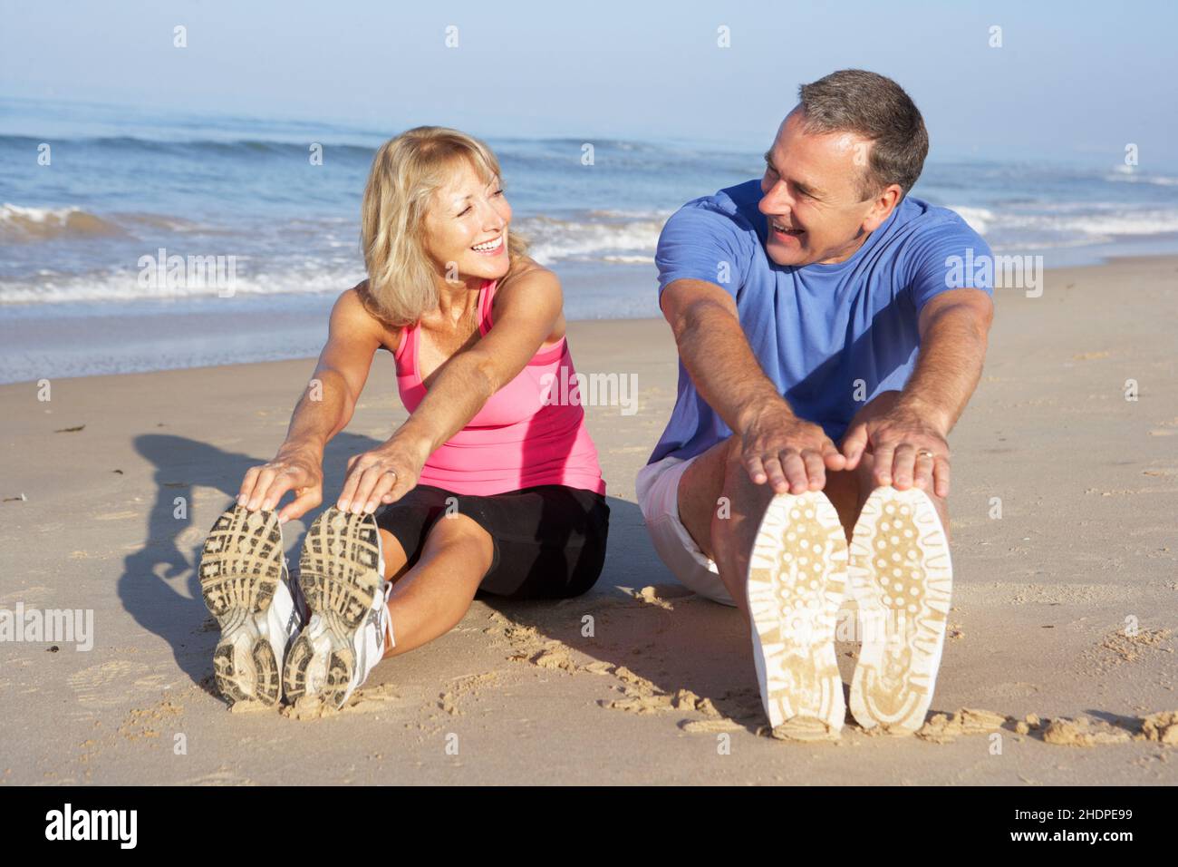 couple, active, stretching, pairs, fit, stretch Stock Photo - Alamy