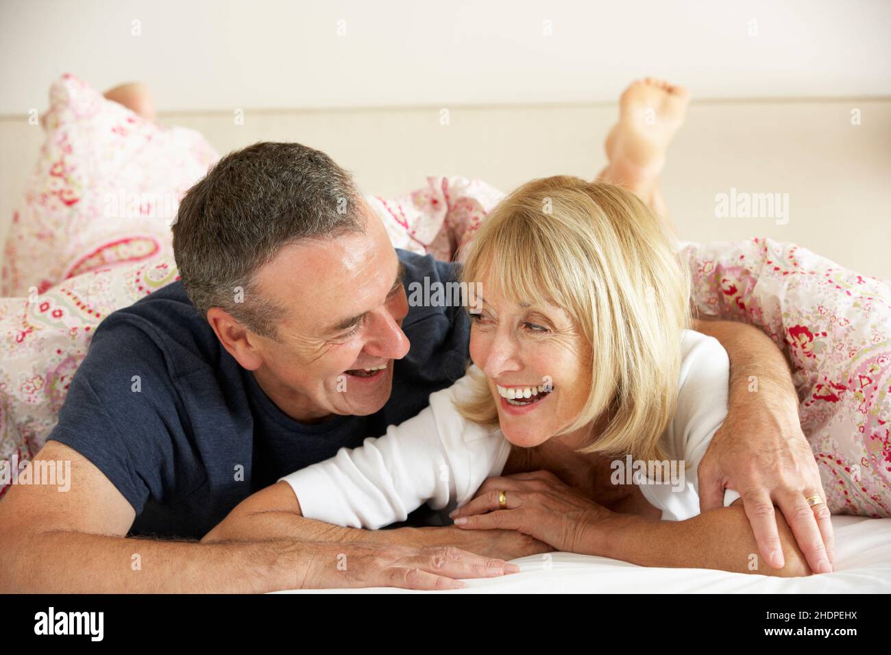 Mature Couple Cuddle Bed High Resolution Stock Photography and Images ...