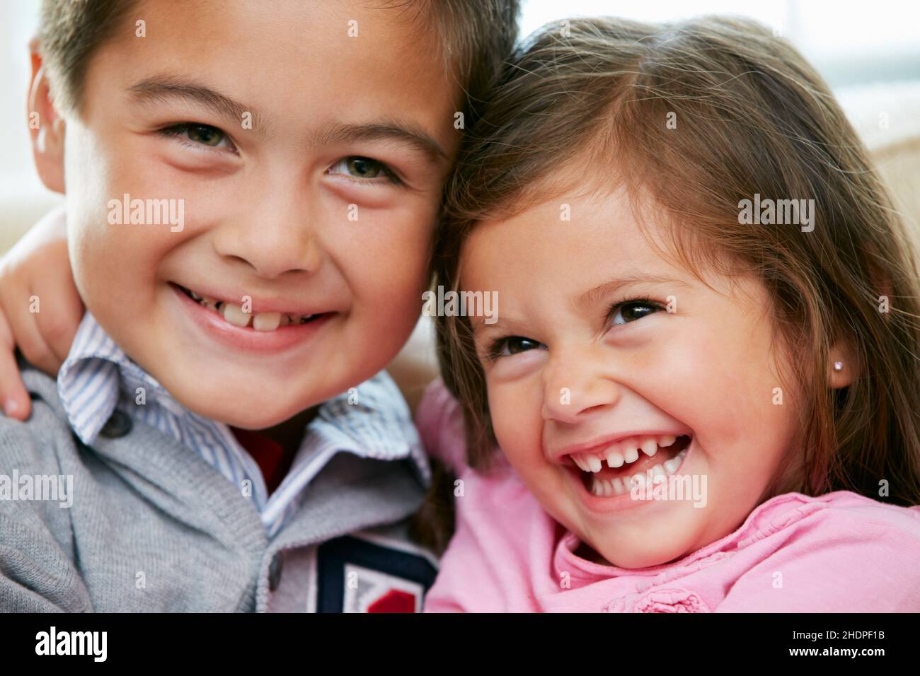 Brother and sister cuddling hi-res stock photography and images - Alamy