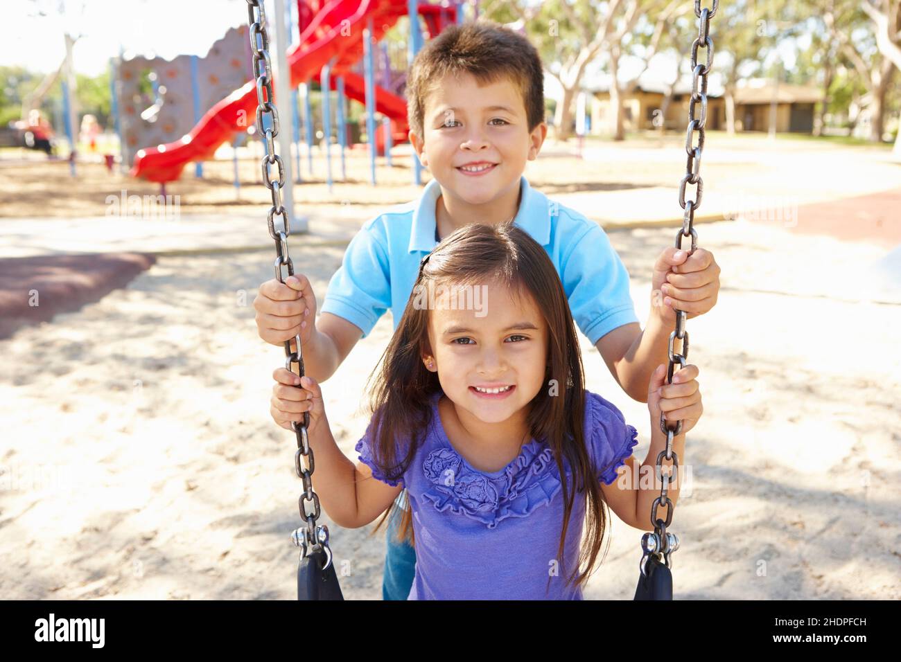 child, rocking, siblings, children, childs, kid, kids Stock Photo - Alamy