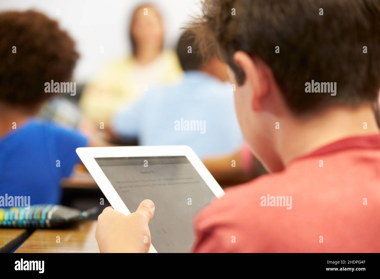 Three children ipad classroom hi-res stock photography and images - Alamy