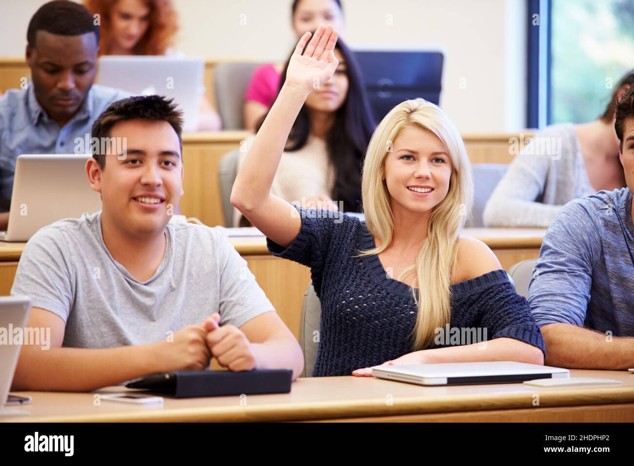 Women raising hands indoor hi-res stock photography and images - Alamy