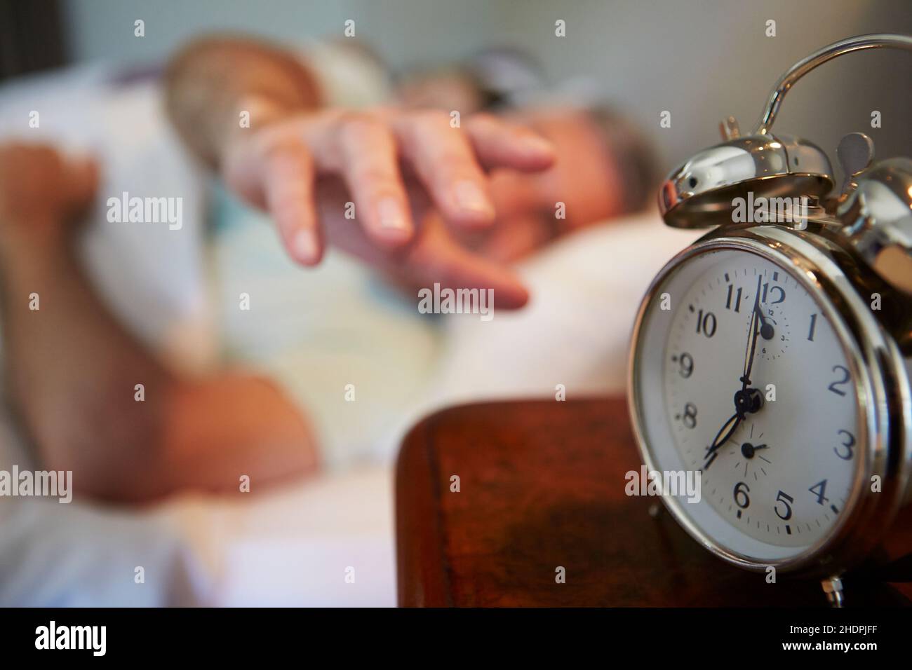 Couple asleep alarm clock hi-res stock photography and images - Alamy