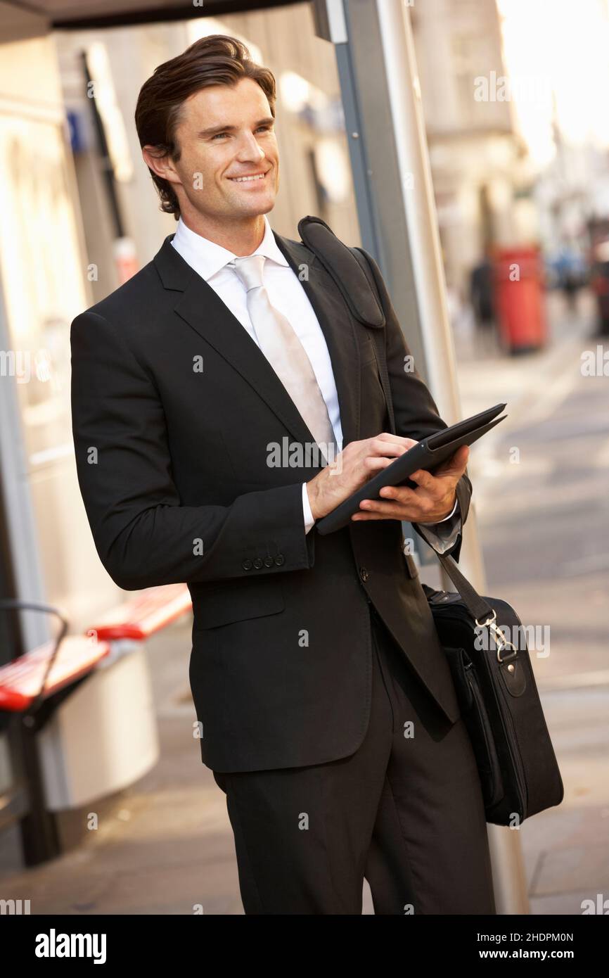 Business suit tablet bus hi-res stock photography and images - Alamy