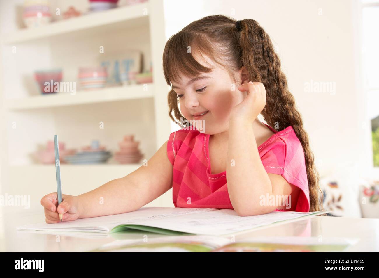 girl, homework, Down syndrome, girls, homeworks Stock Photo - Alamy