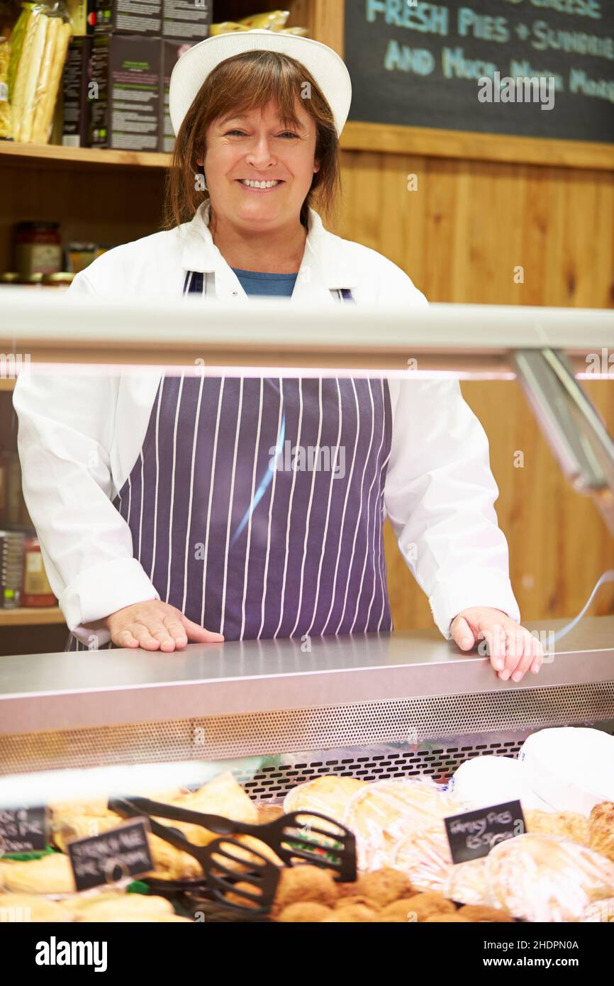 Woman shop sales counter clothes hi-res stock photography and images ...