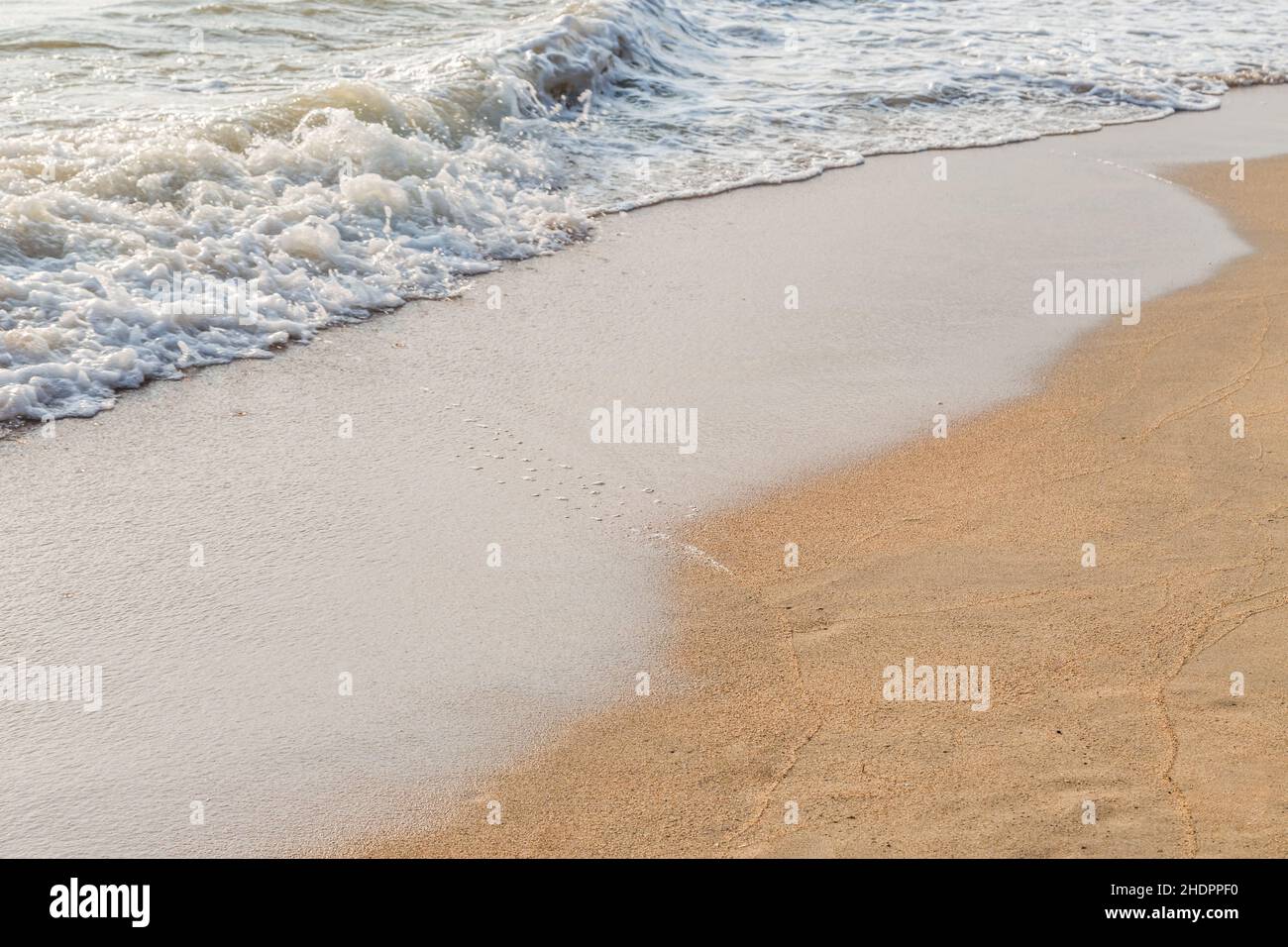 White water wave of the sea on the sandy beach background Stock Photo ...