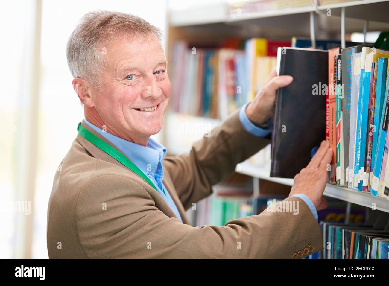 Men remove books hi-res stock photography and images - Alamy
