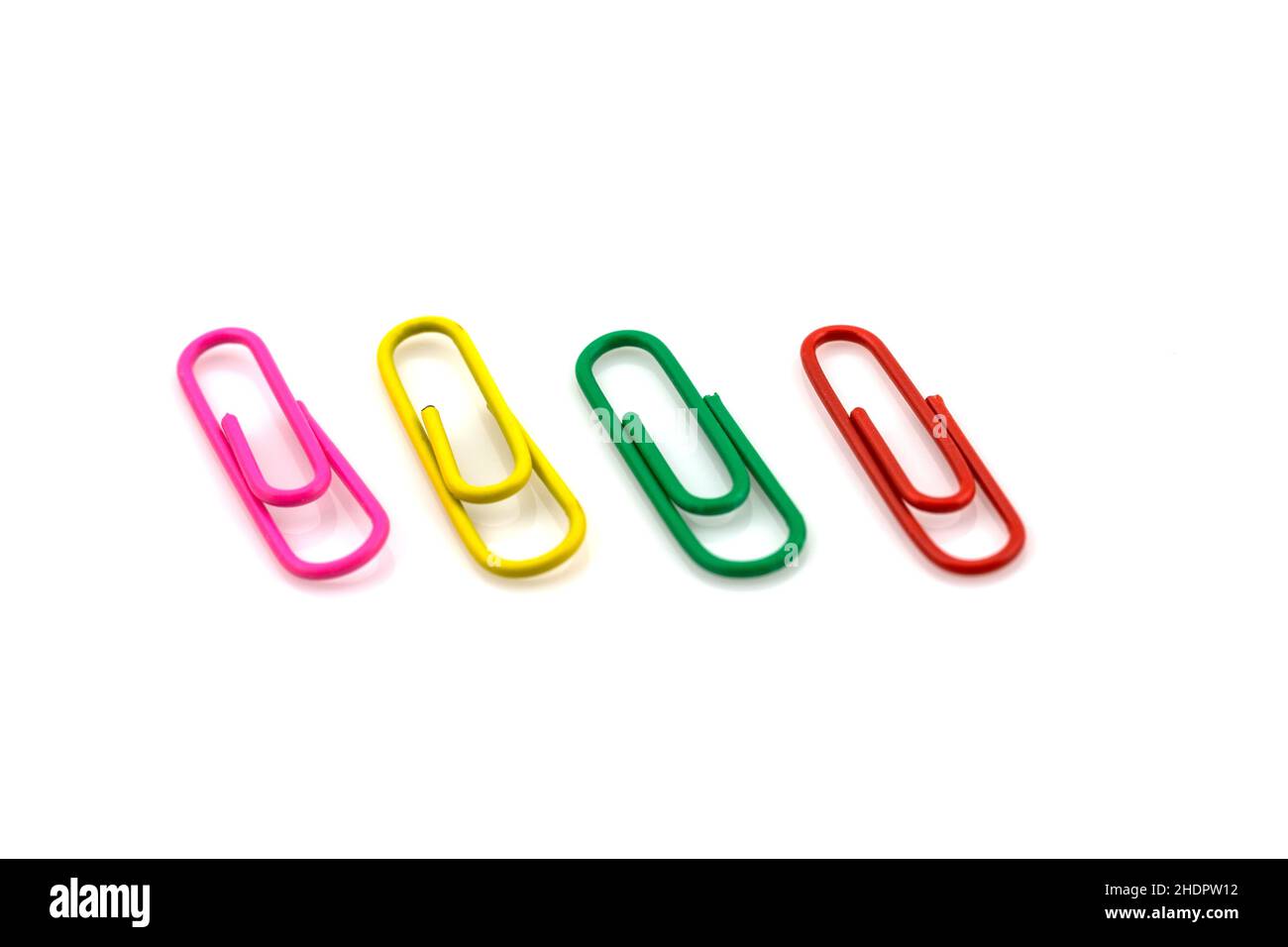 Colorful paper clips isolated on white background Stock Photo - Alamy