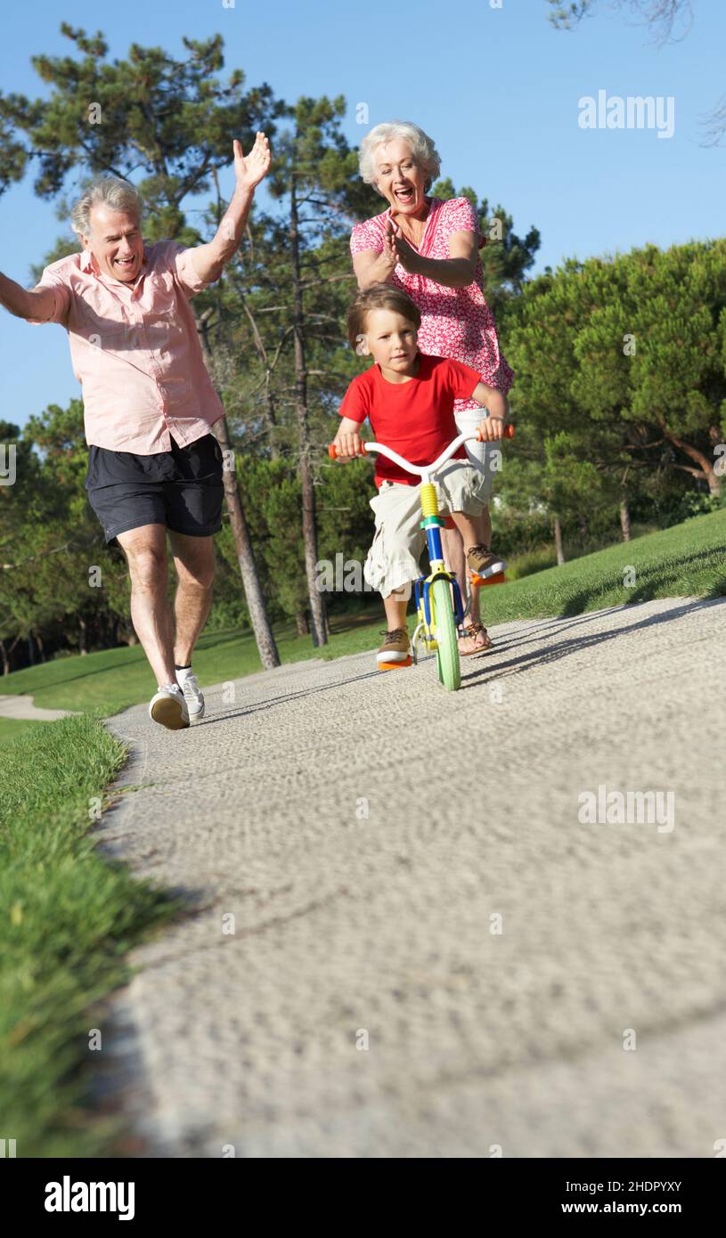 boy, cycling, grandparent, cheering, boys, grandparents Stock Photo - Alamy