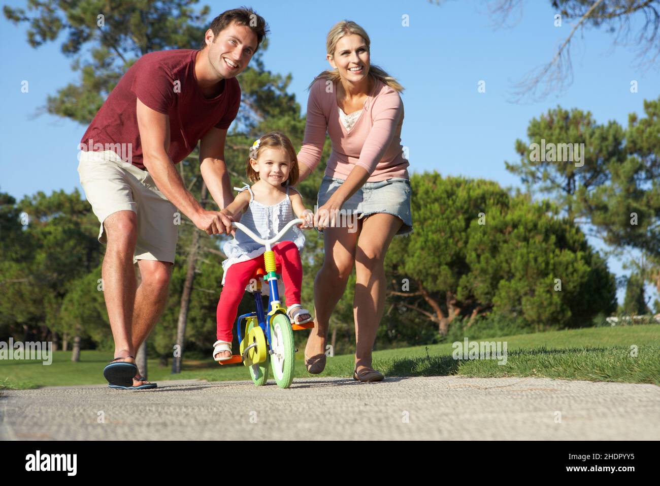 Middle aged woman learning bicycle hi-res stock photography and images ...