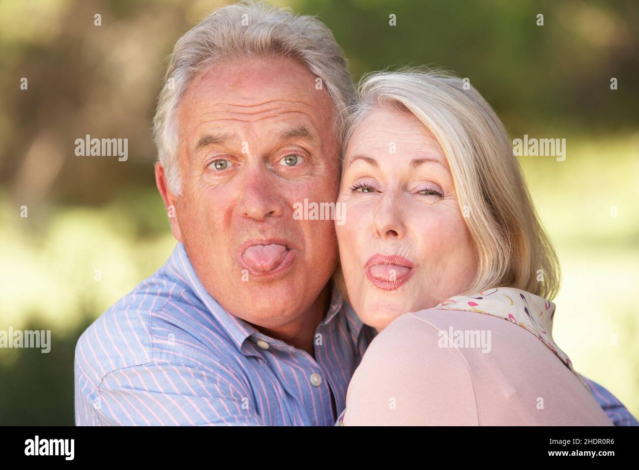sticking out tongue, fool around, older couple, poking tongues ...