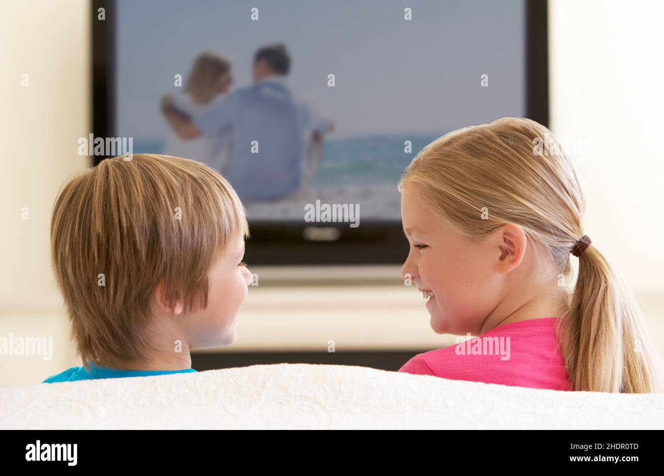 watching tv, siblings, television, tv Stock Photo - Alamy