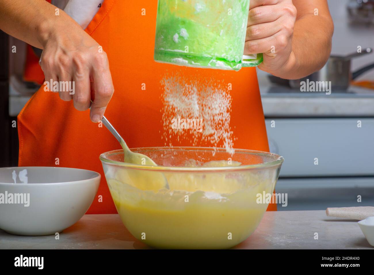 pour flour into a cup with ingredients Stock Photo - Alamy