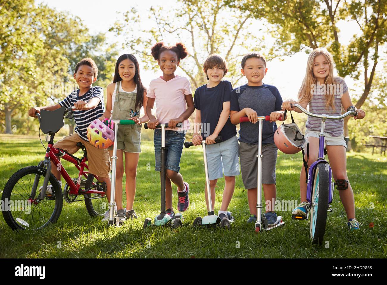 Group of kids with scooters hi-res stock photography and images - Alamy