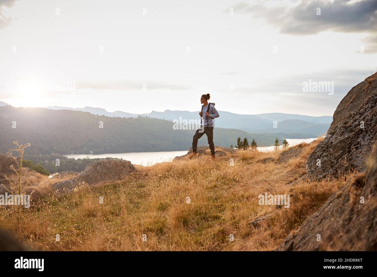Back view young man hiking hi-res stock photography and images - Alamy