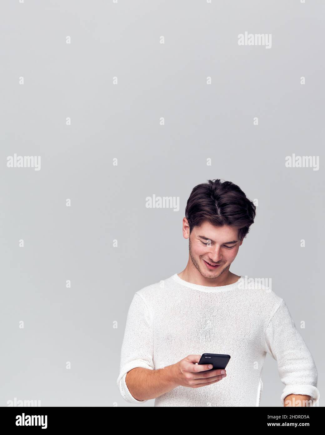 Males using phones hi-res stock photography and images - Alamy