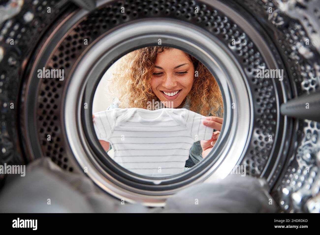 Lady washing clothes hi-res stock photography and images - Alamy