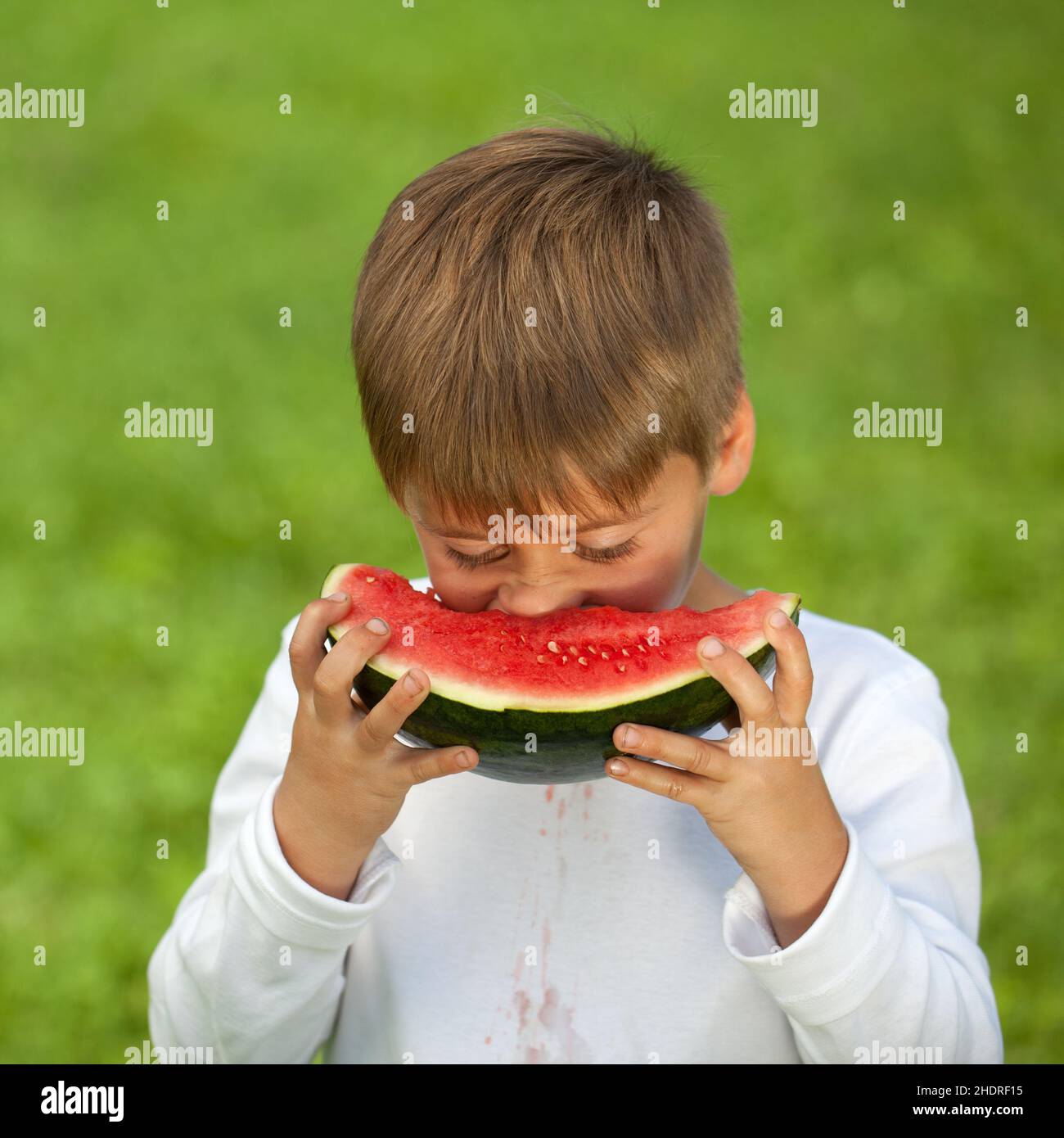 Children eating watermelon outside hi-res stock photography and images ...