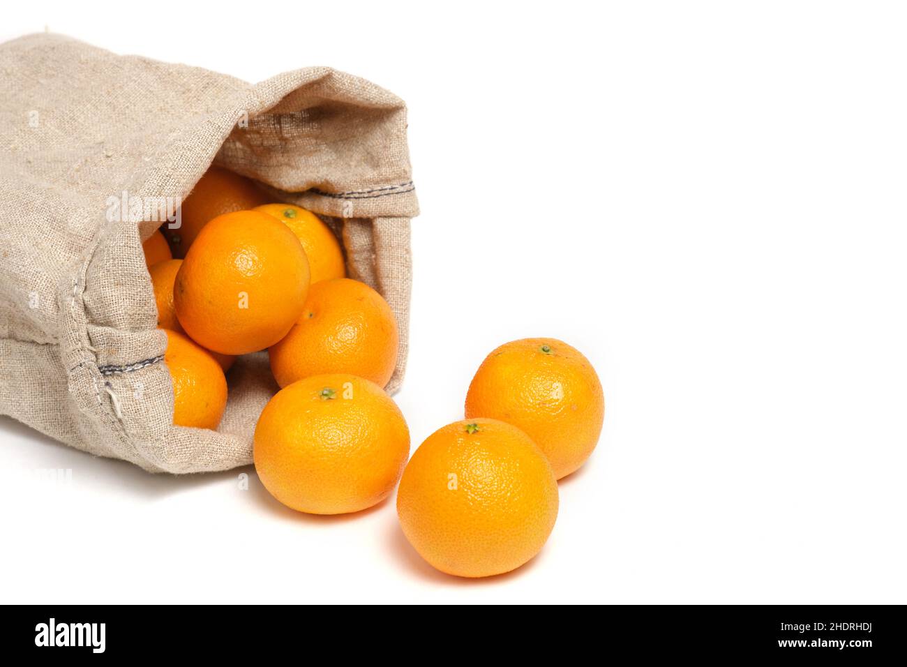Scattered tangerines from bag on white background Stock Photo - Alamy