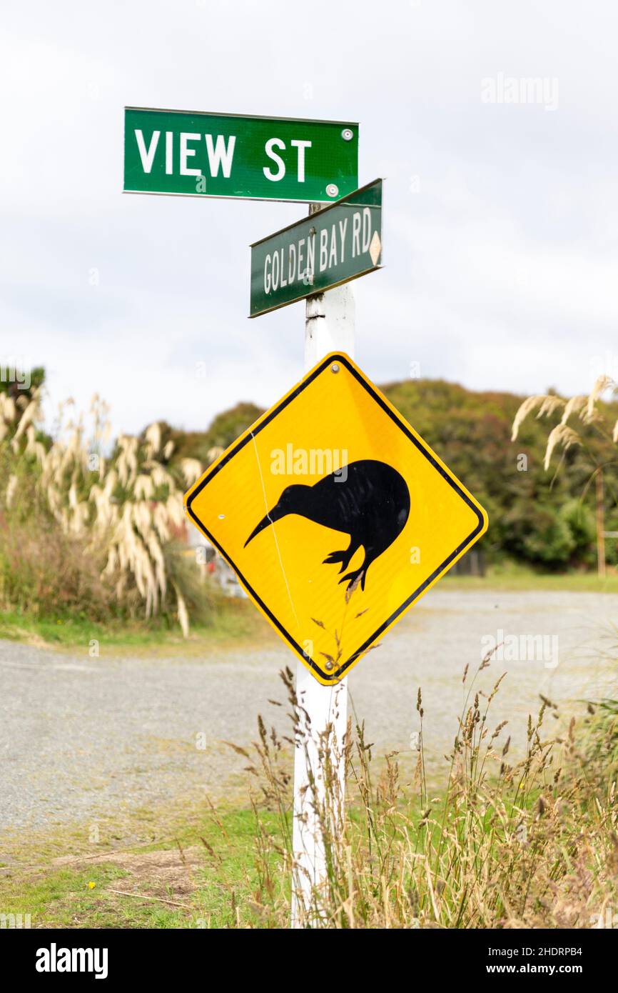 A roadside sign notifies drivers to be cautions as Kiwi birds inhabit ...
