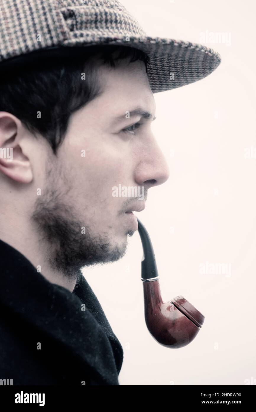 Young man smoking pipe hi-res stock photography and images - Alamy