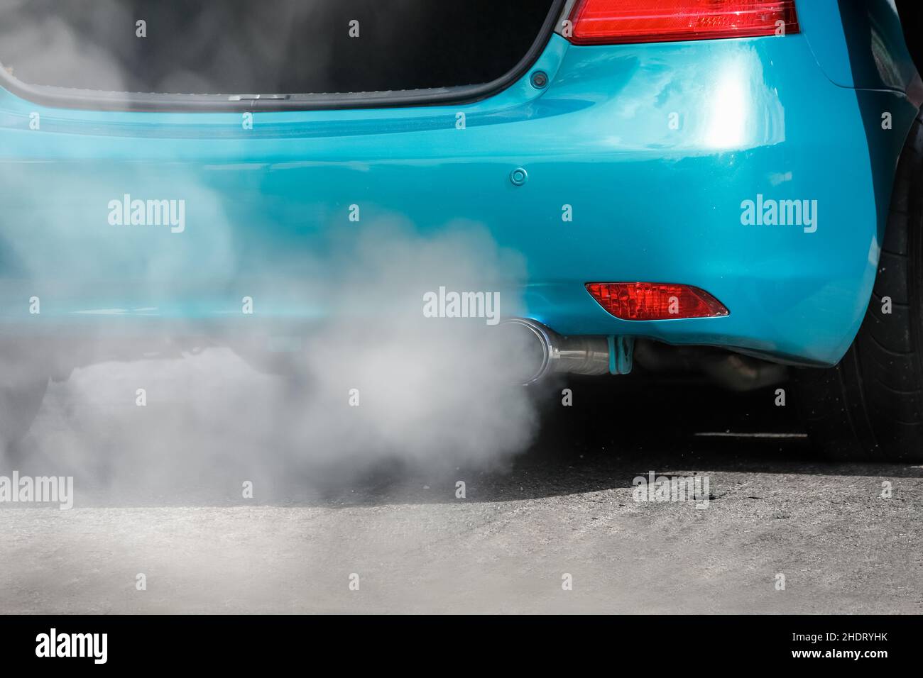 air pollution crisis from car exhaust pipe on road Stock Photo - Alamy