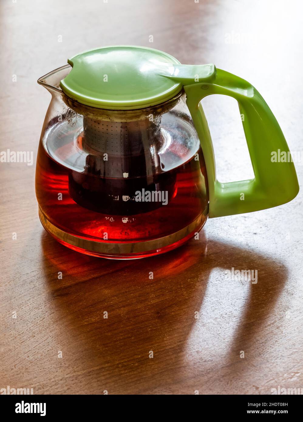 Modern teapot made of glass with a grid inside Stock Photo - Alamy