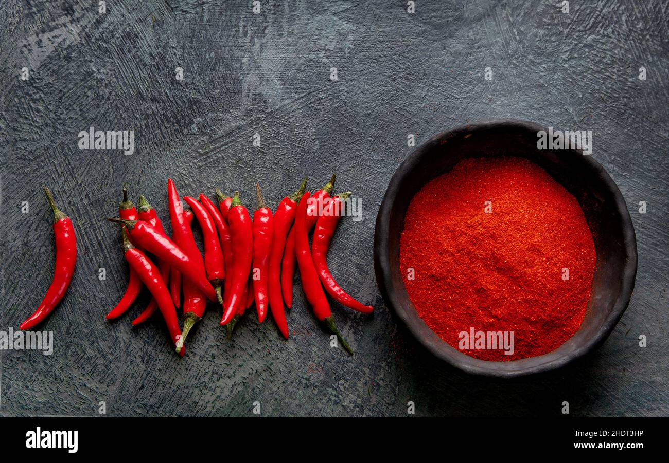 Red chili or chilli cayenne pepper on dark background. Traditional ...