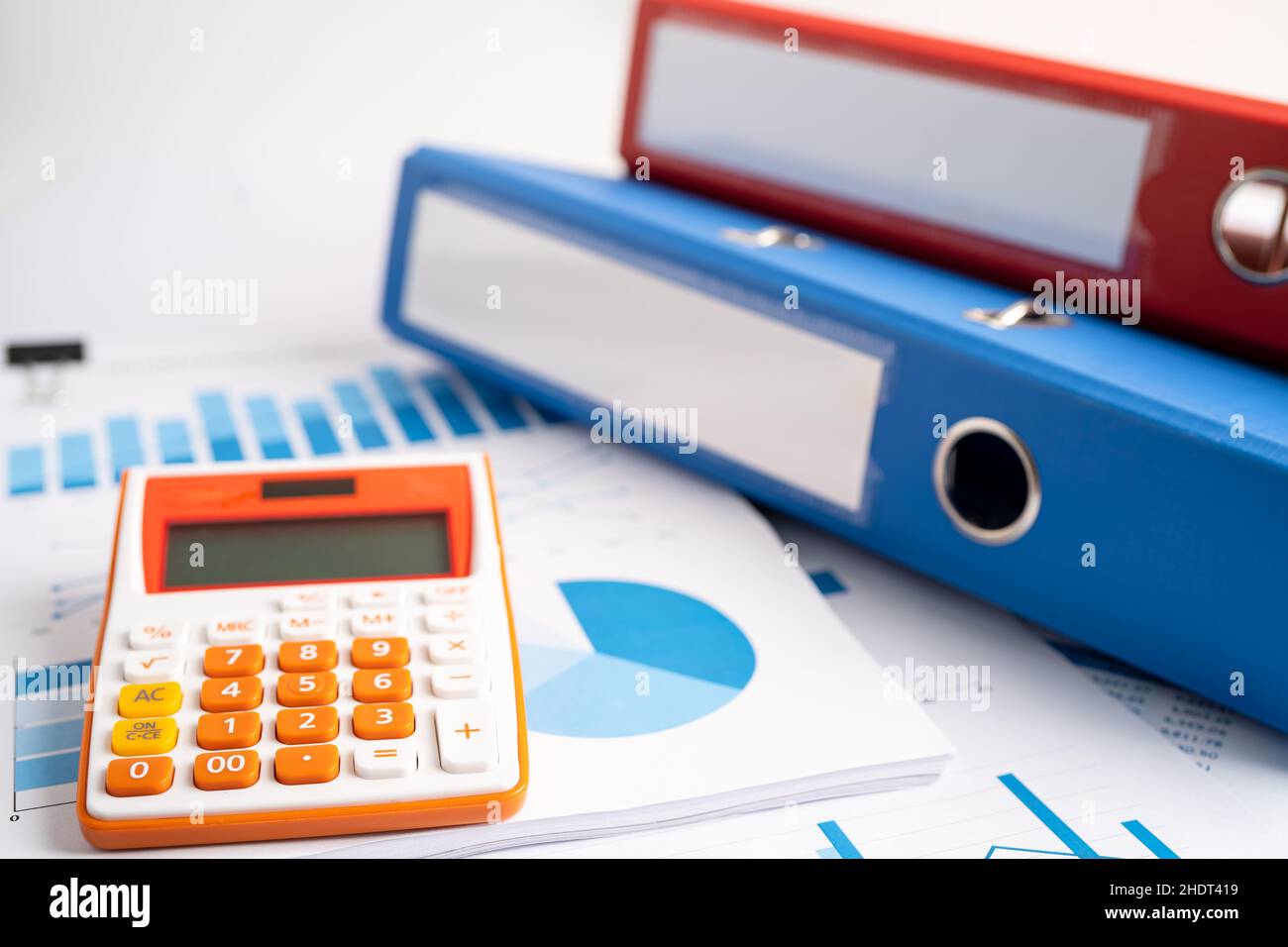 Binder data finance report business with calculator on graph analysis ...