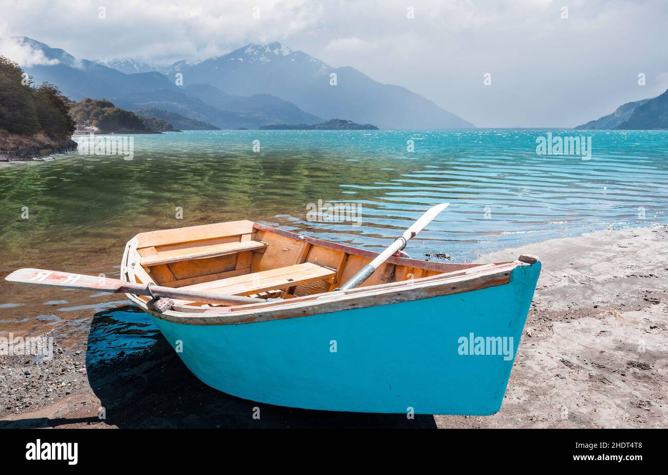 Boat on a beautiful mountains lake Stock Photo - Alamy