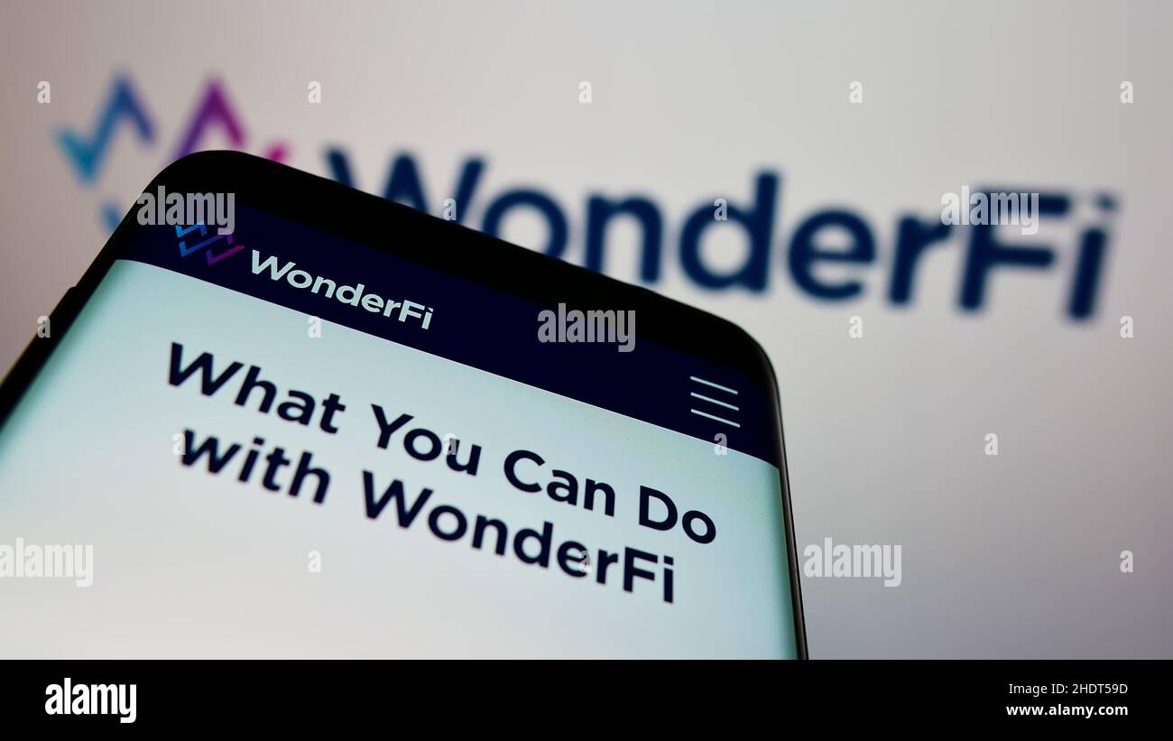 Mobile phone with webpage of Canadian fintech company WonderFi ...