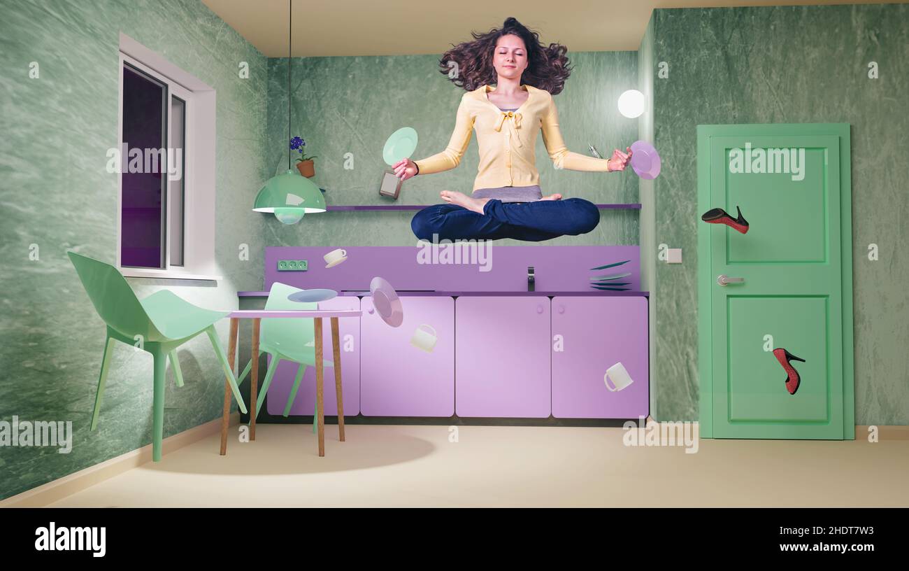 young woman levitating by yoga pose in the kitchen Stock Photo - Alamy