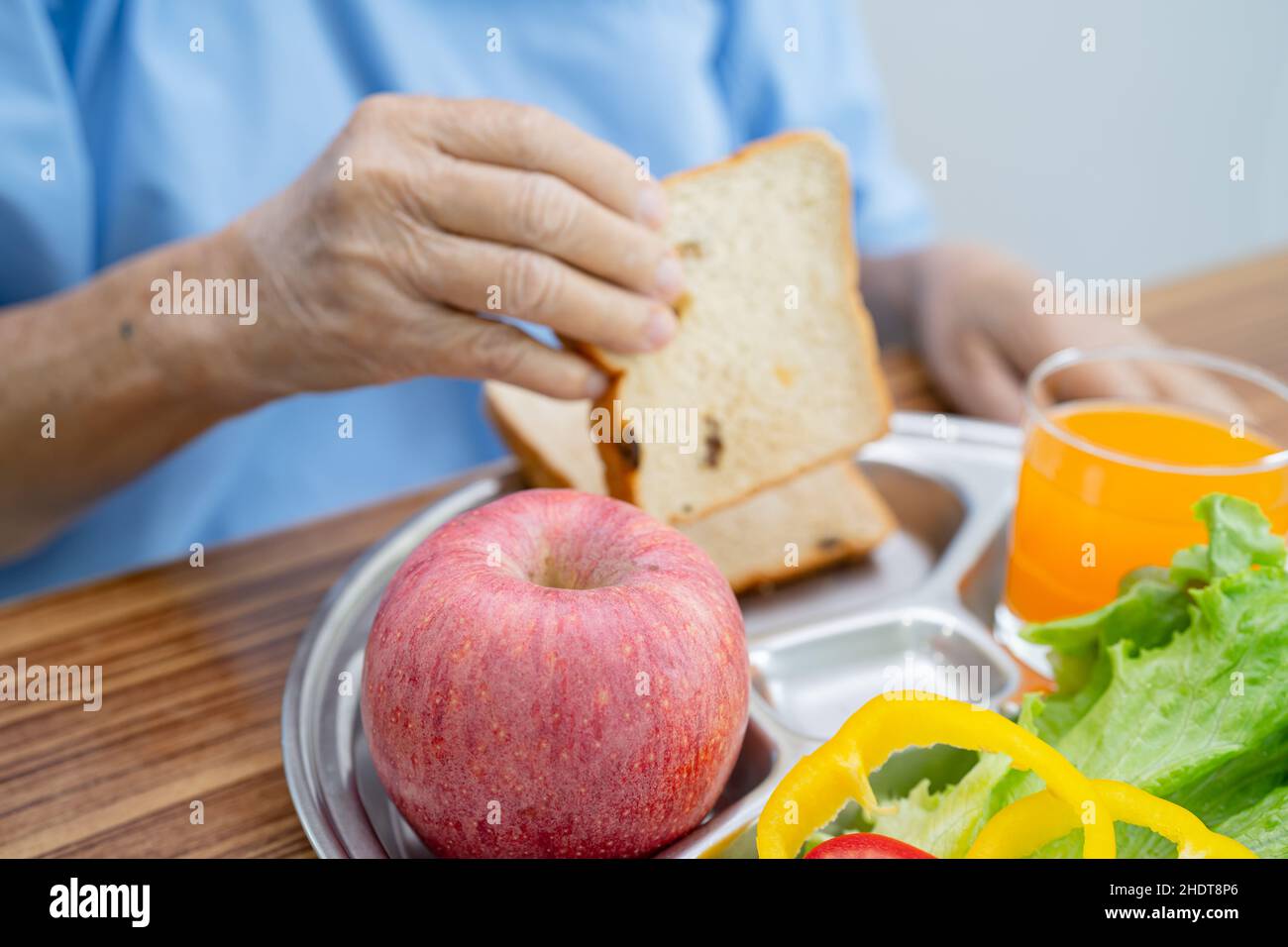 Asian senior or elderly old lady woman patient eating breakfast vegetable healthy food with hope ...