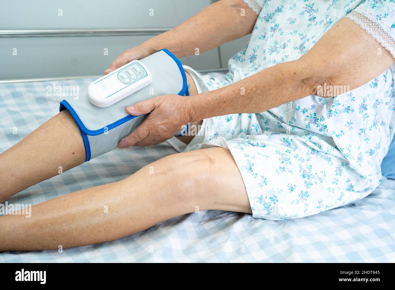 Asian senior or elderly old woman patient with Cordless Air Compression ...