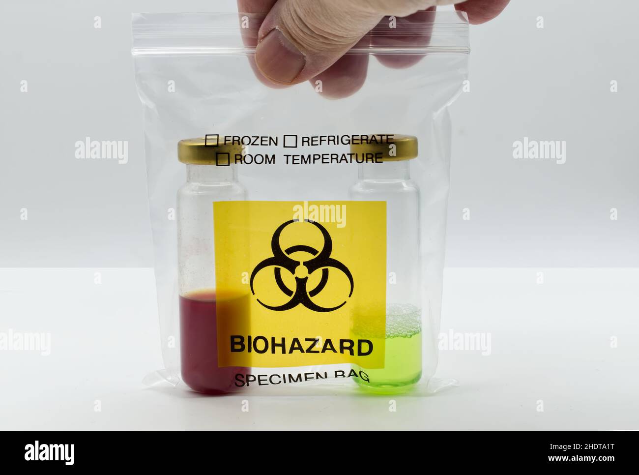 Scientist holding test tubes biohazard hi-res stock photography and ...