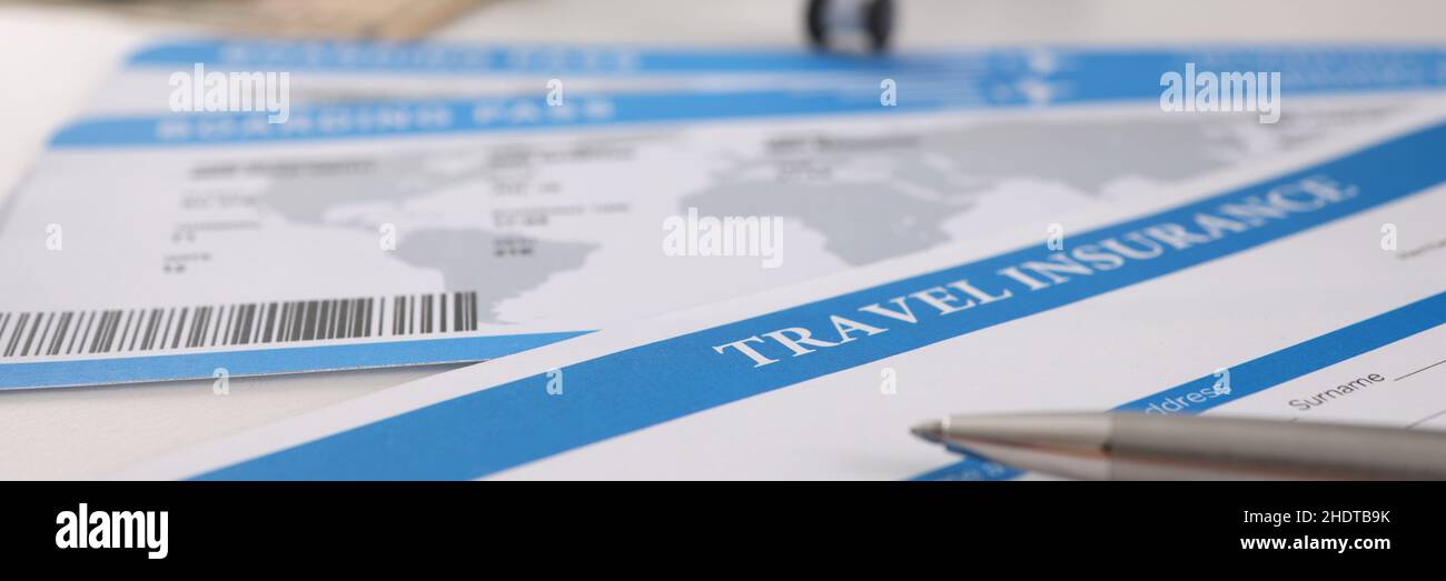 Medical insurance contract for tourists pen and plane on table Stock ...