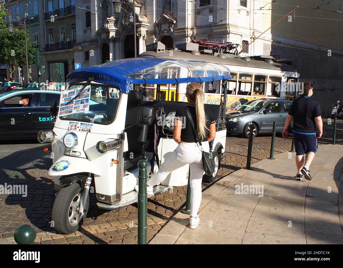 Street scene with tuk-tuk auto-rickshaw at Largo do Chiado, Church of ...