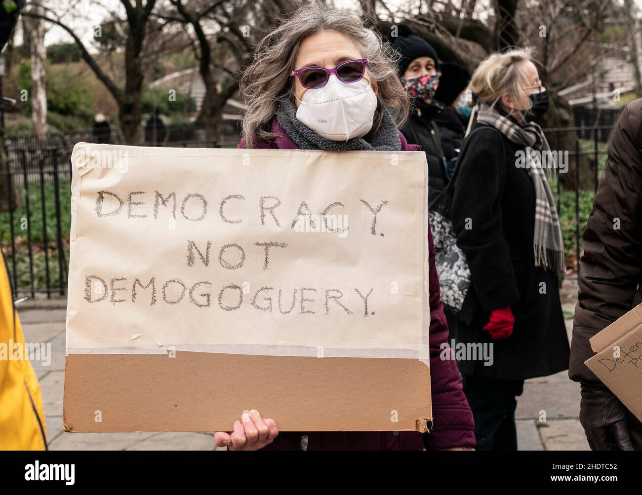 New York, NY - January 6, 2022: People hold posters at Vigil for ...