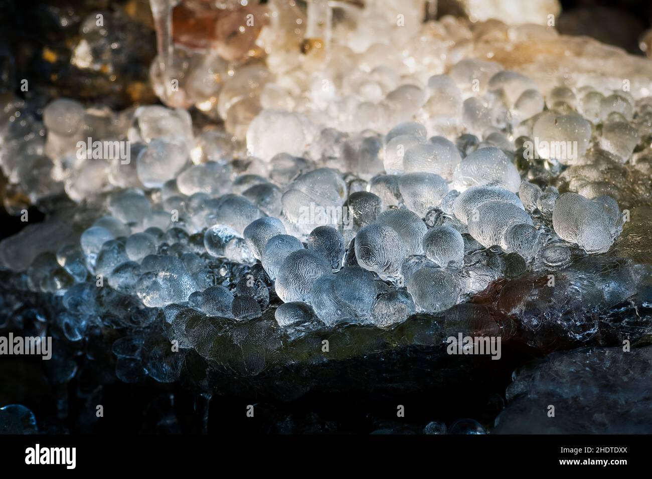 Frozen ice water balls at a waterfall Stock Photo - Alamy