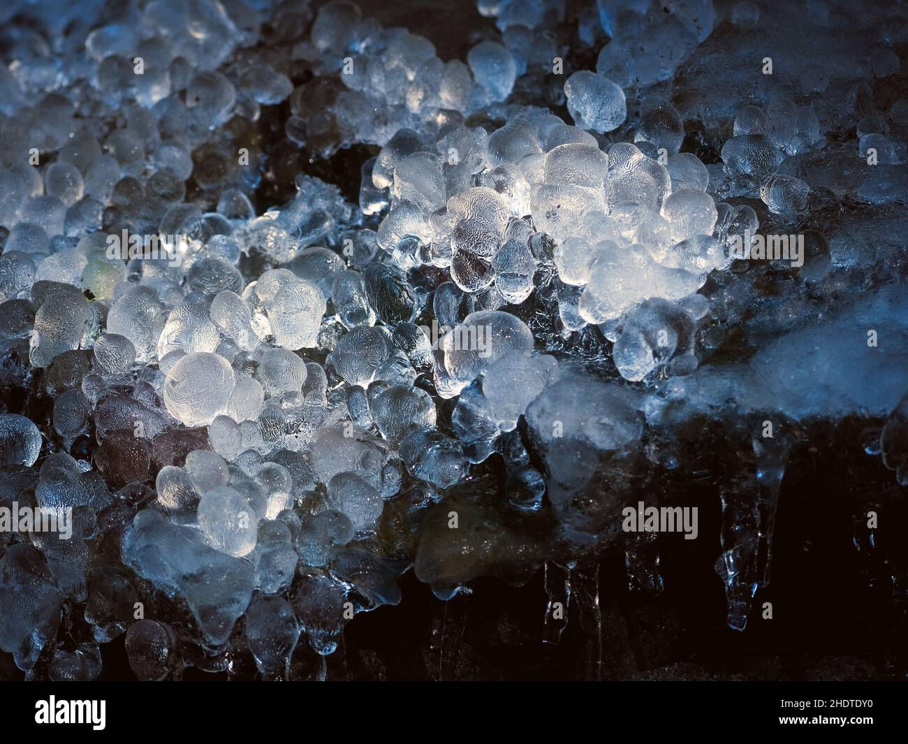 Frozen ice water balls at a waterfall Stock Photo - Alamy