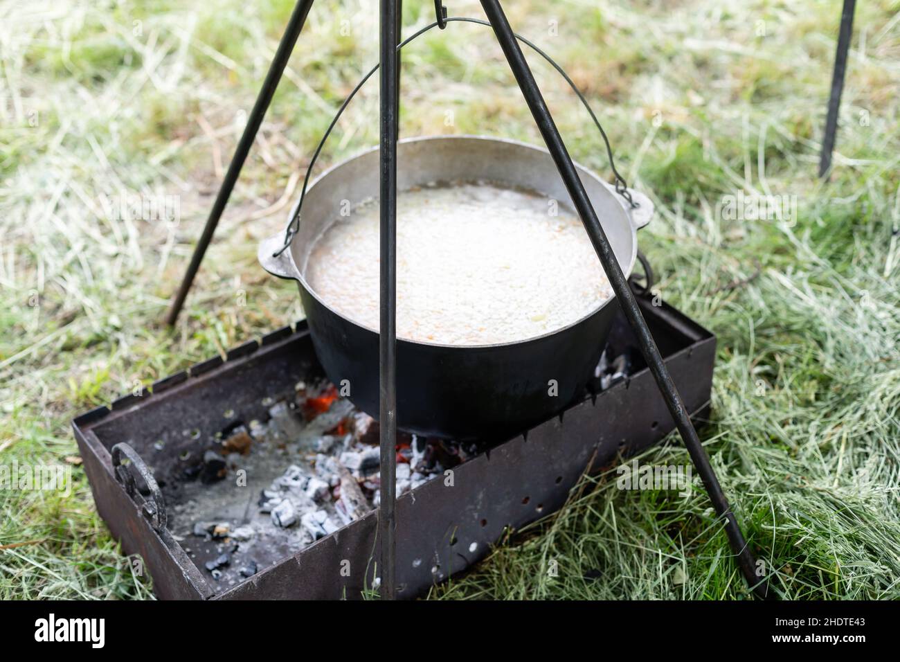 Porridge on the fire. Picnic and food in nature. Lifestyle Stock Photo ...