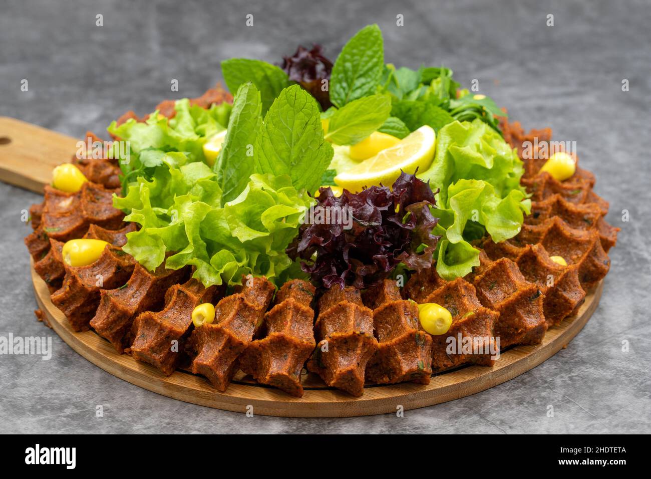 Raw meatballs (cig kofte) on a dark background. Traditional Turkish ...