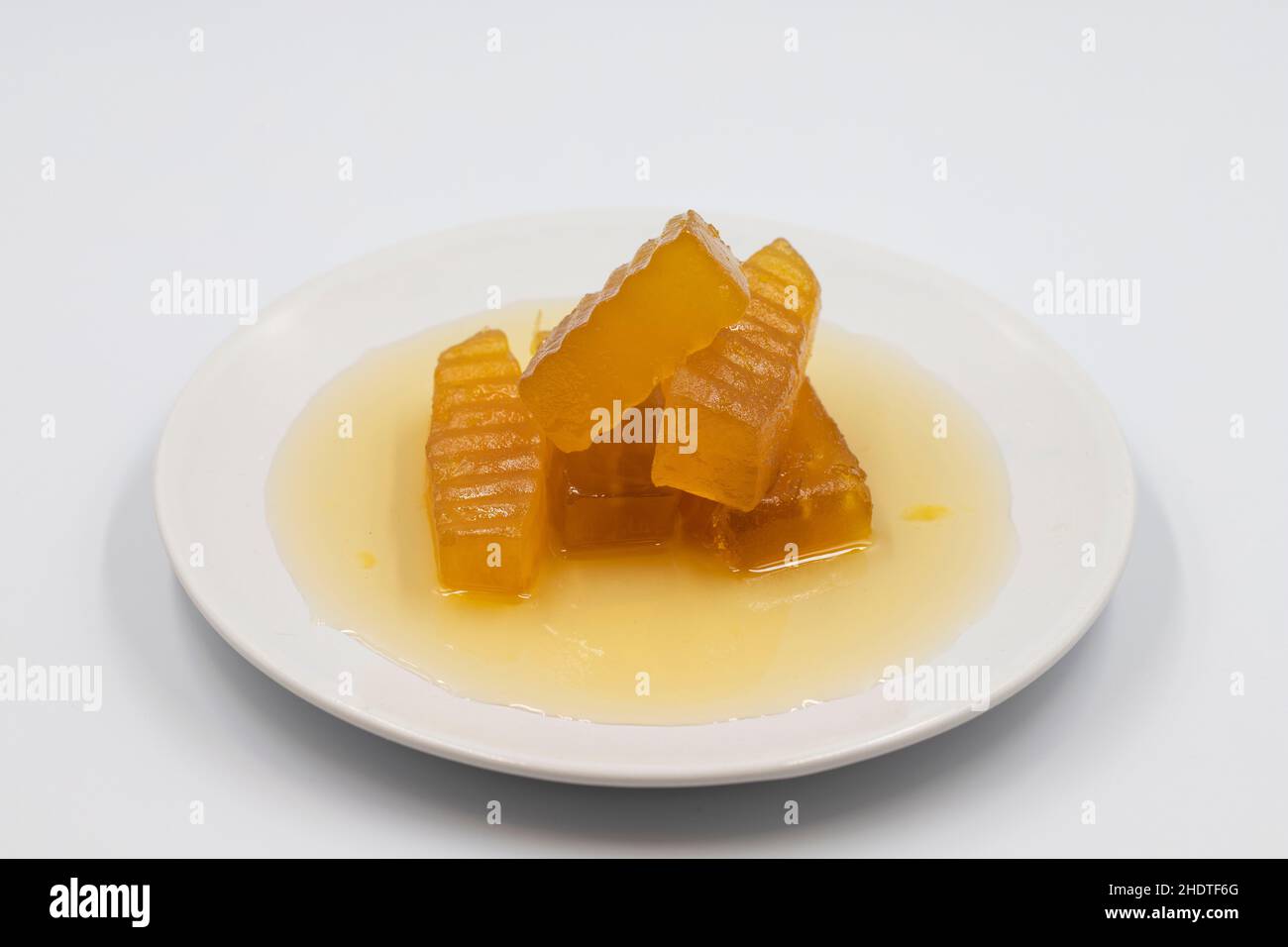 Pumpkin dessert with syrup on white background. Traditional ...