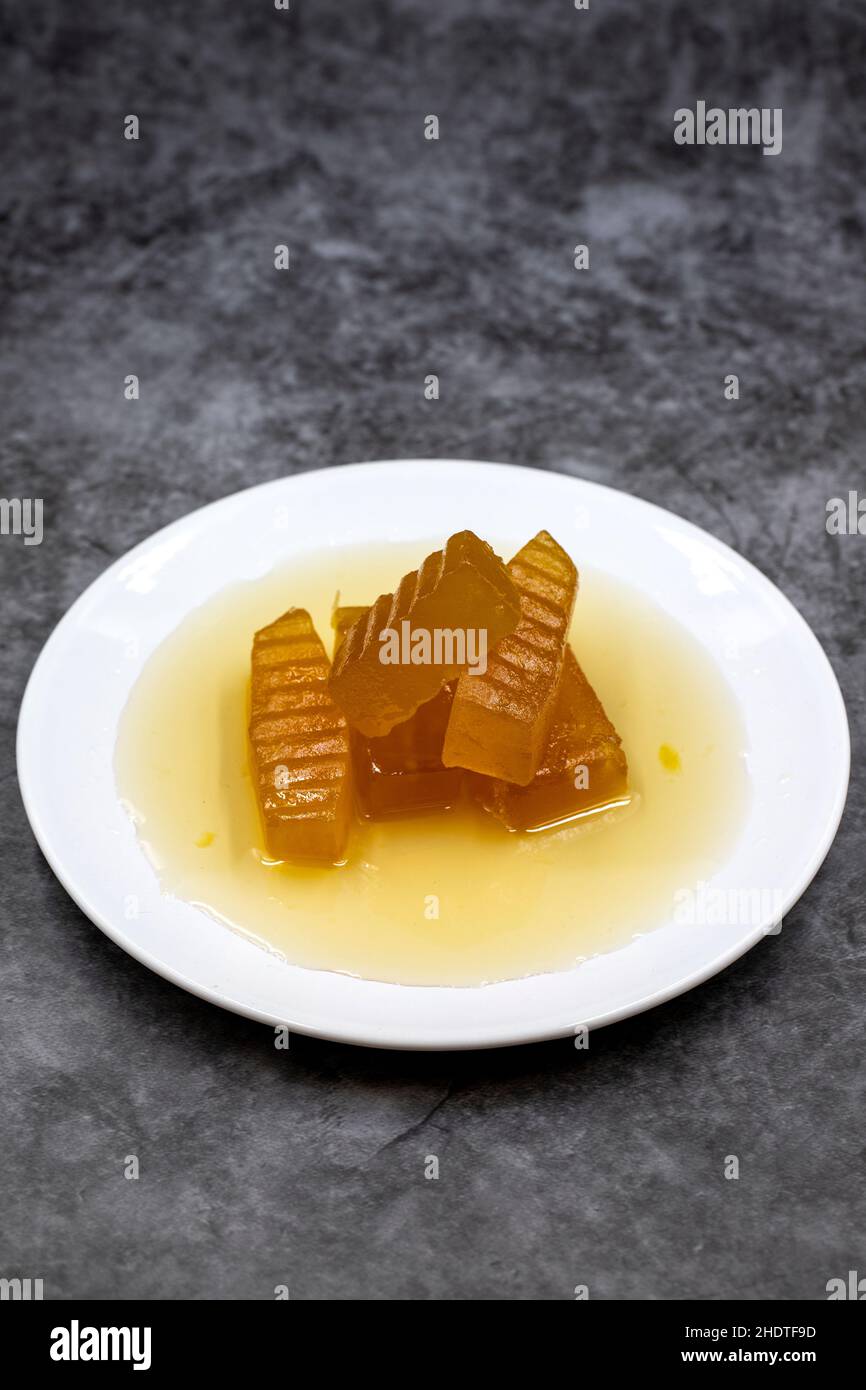Pumpkin dessert with syrup on dark background. Traditional ...